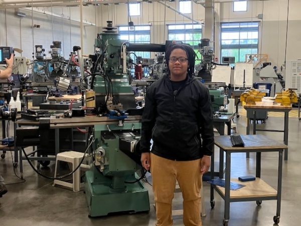 Christian Rolle a CNC machinist at Asnuntuck Community College. | CT Mirror
