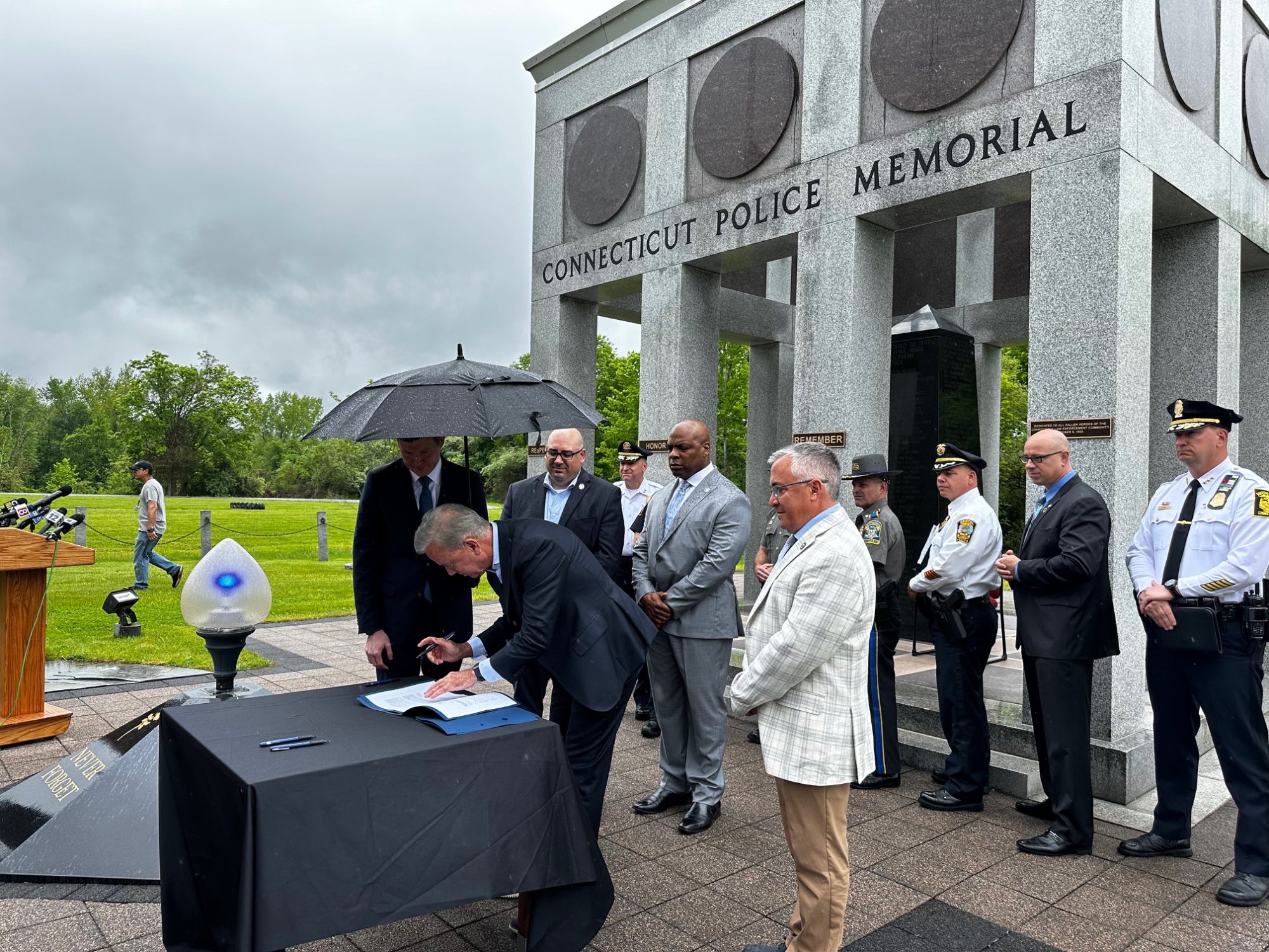 Lamont signs CT bill codifying benefits for families of fallen officers